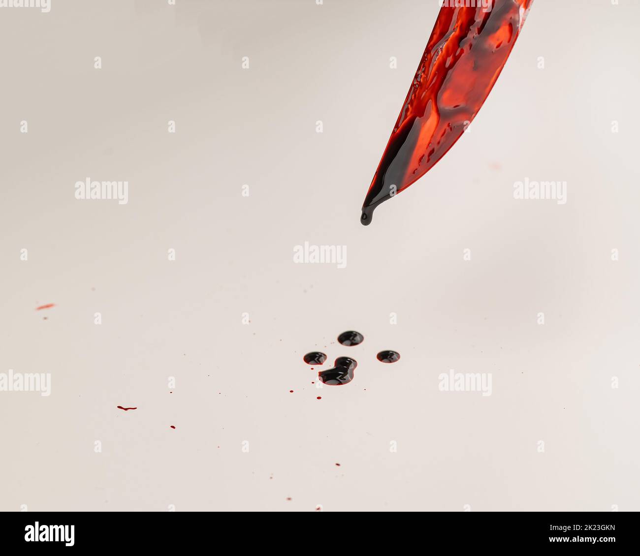 Close-up of a sharp knife covered in blood on a white background Stock ...