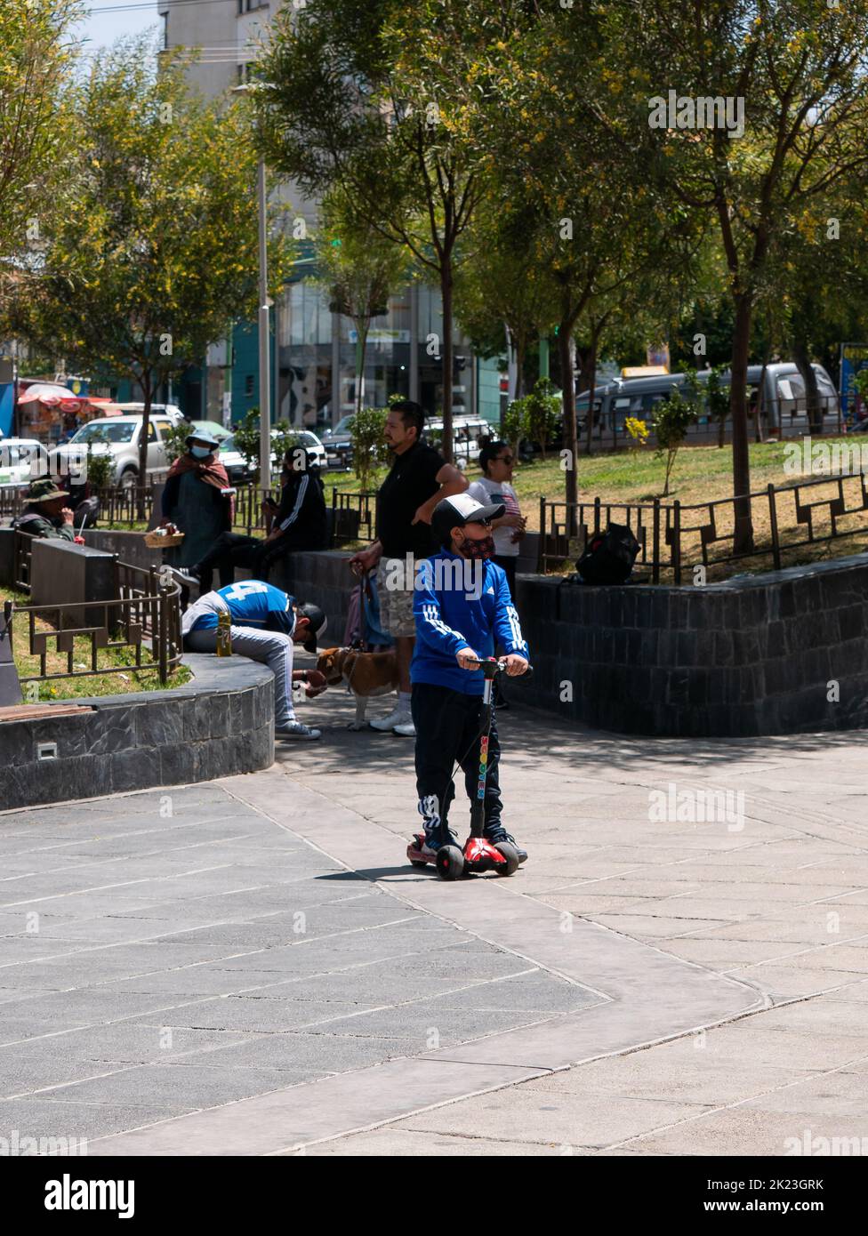 La Paz, Bolivia - September 11 2022: Little Boy Riding a Scooter in the ...