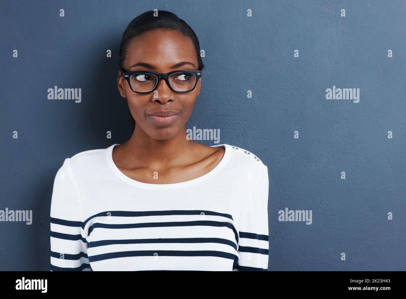 Shes got her eye on you. an attractive young woman wearing glasses ...