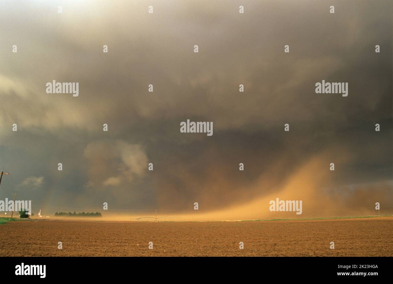 Dust and soil being drawn into a rotating supercell thunderstorm near ...