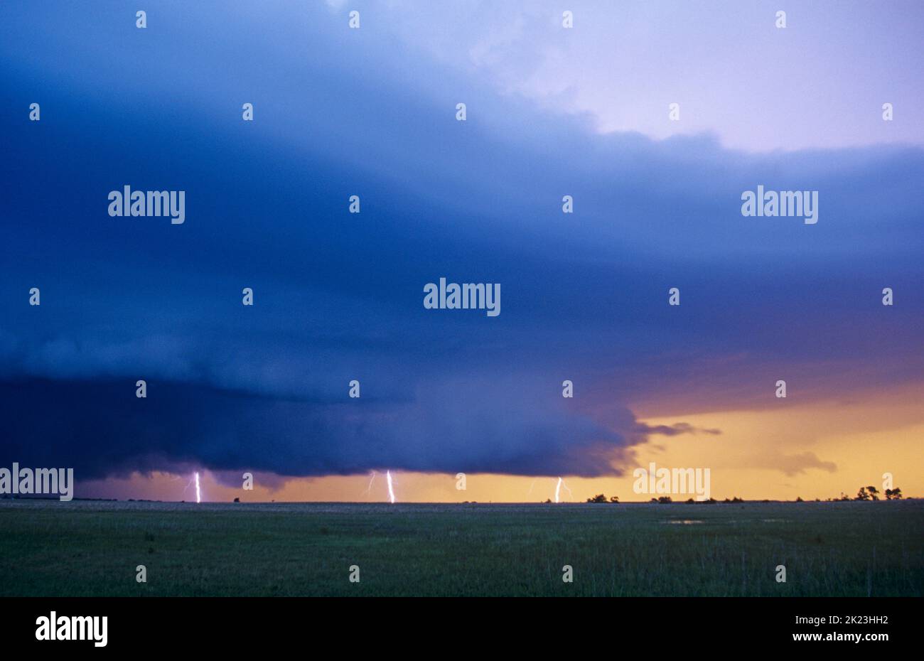 Amazing sunset colours as lightning strikes from underneath a severe ...