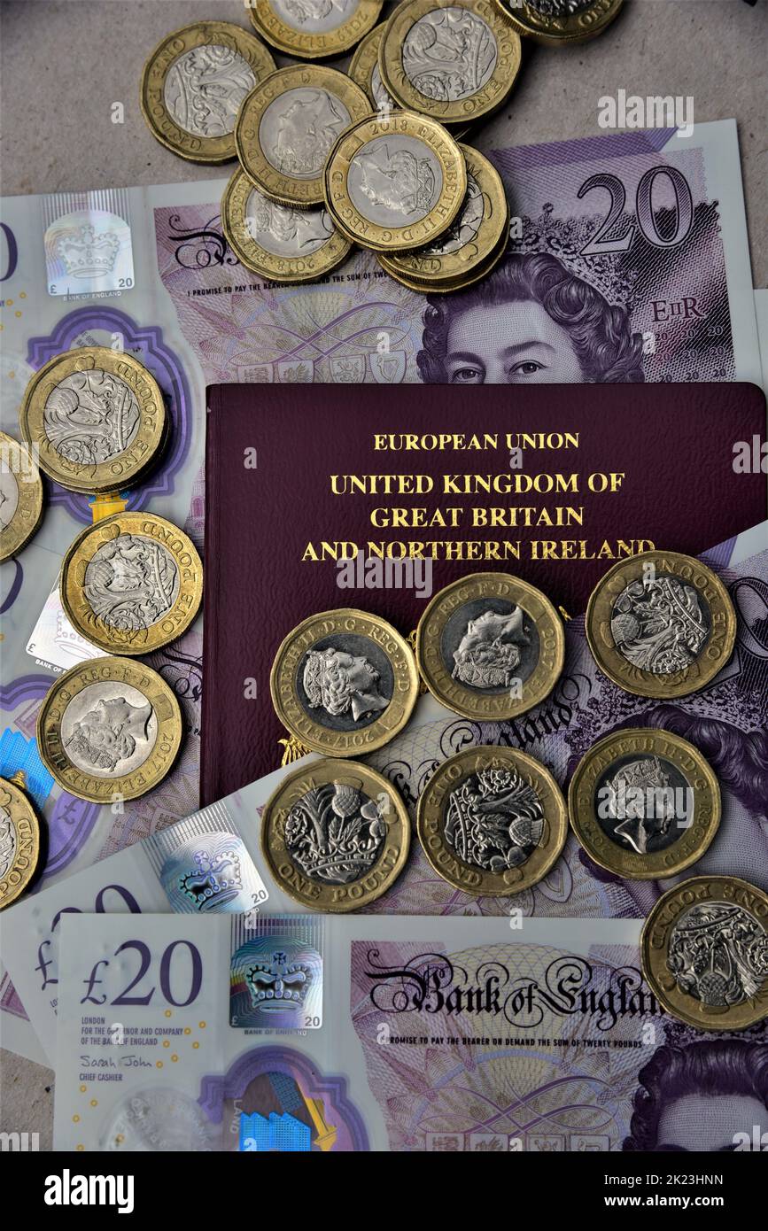 Uk sterling, twenty pound notes and one pound coins pictured. Uk and ...