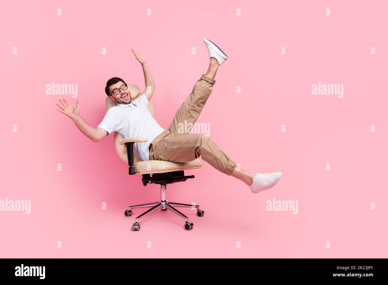 Full size photo of playful guy manager fooling ride fast cozy office ...