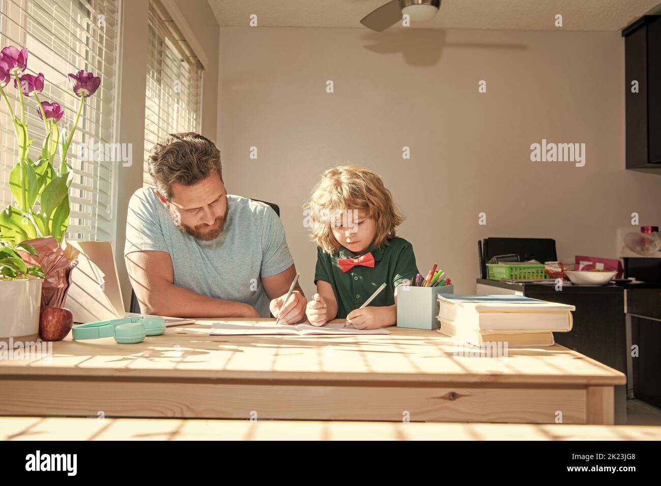 family and parenthood blog. boy do homework with private teacher ...