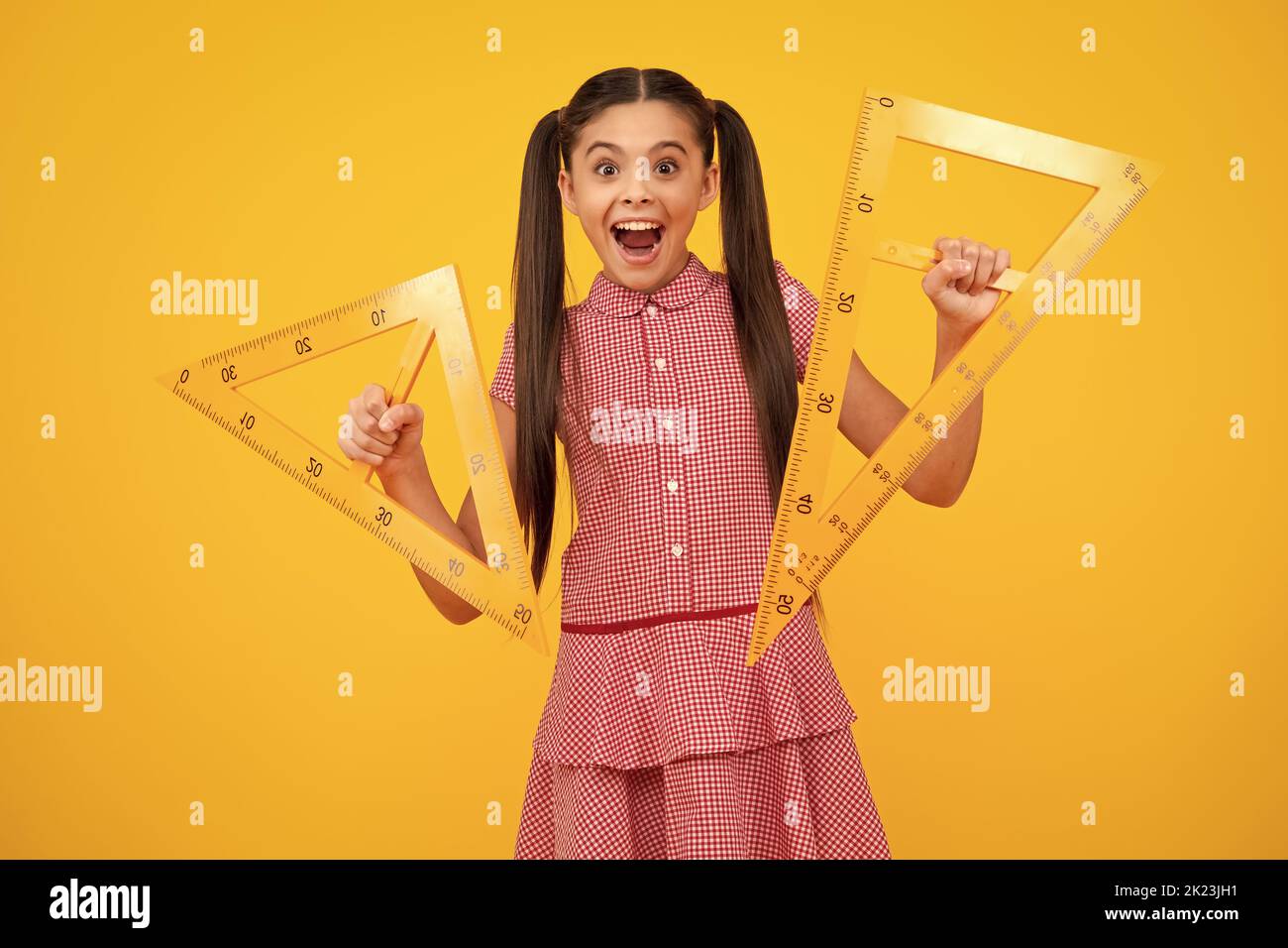 Teenager child school girl holding measure for geometry lesson ...