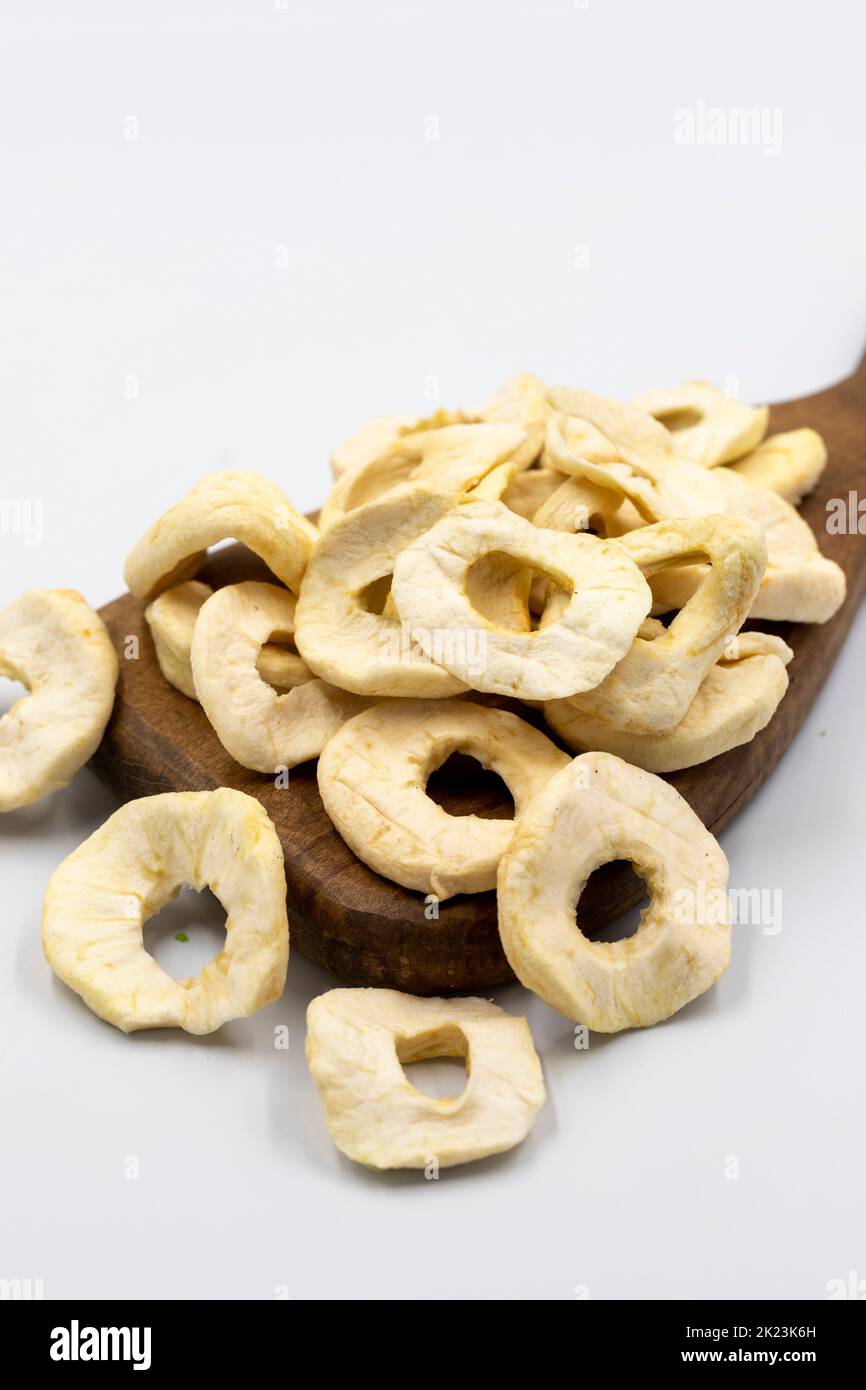 Dried apple slice isolated on white background. Dried fruit in sunlight ...