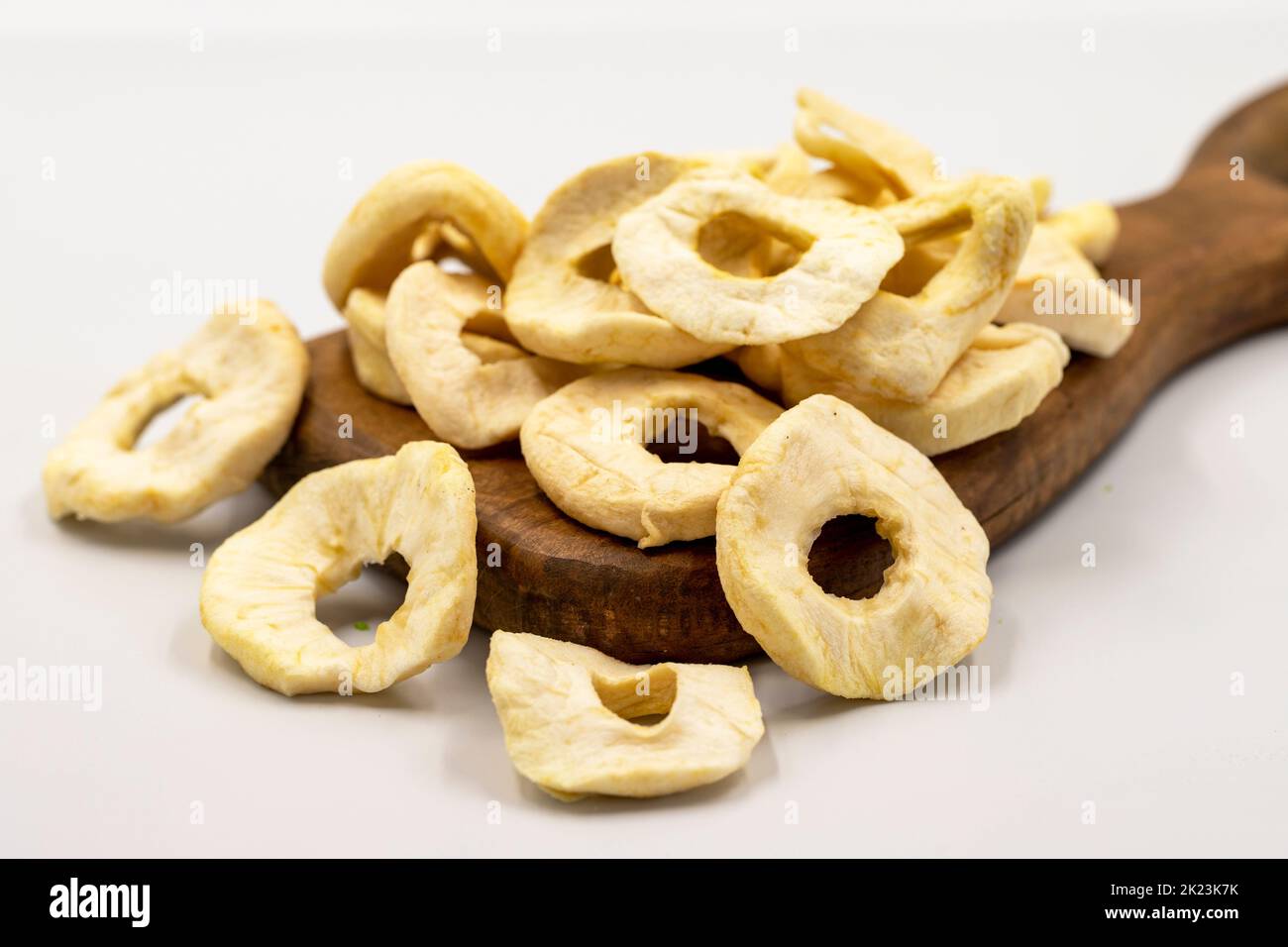 Dried apple slice isolated on white background. Dried fruit in sunlight ...