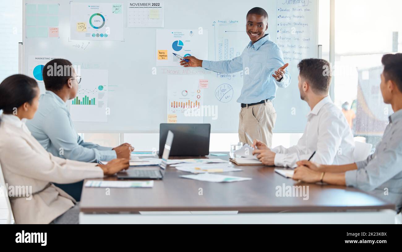 Presentation, team and business man corporate speaker working with ...