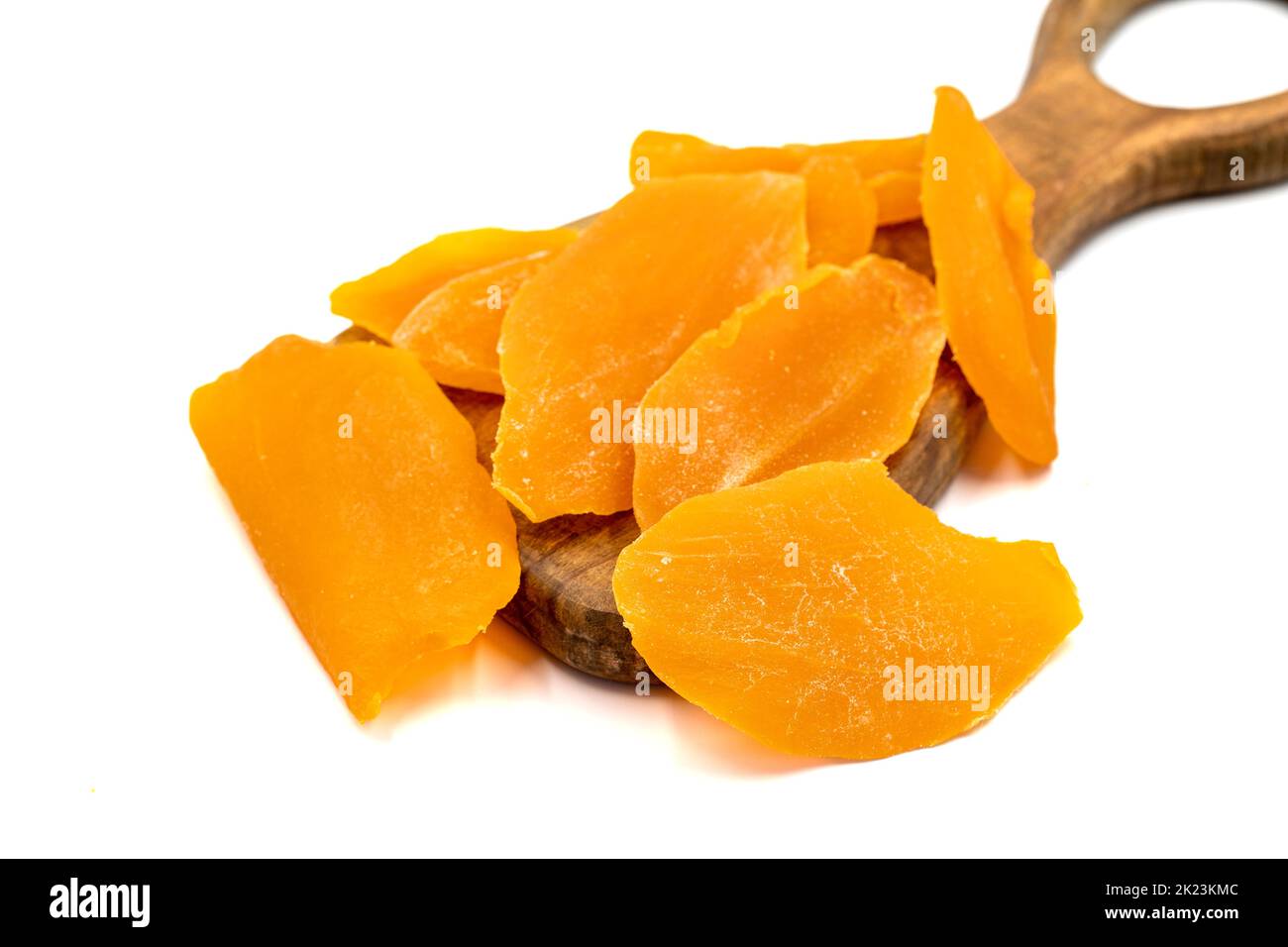 Dried mango slice isolated on white background. Dried fruit in sunlight ...
