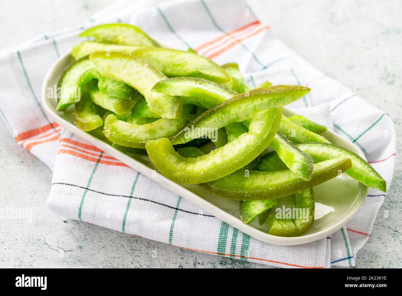 Dried pomelo slice on gray background. Dried fruit in sunlight. close ...