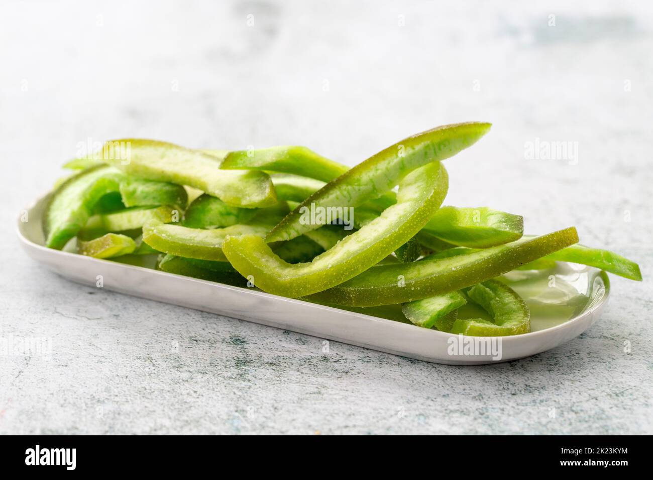 Dried pomelo slice on gray background. Dried fruit in sunlight. close ...