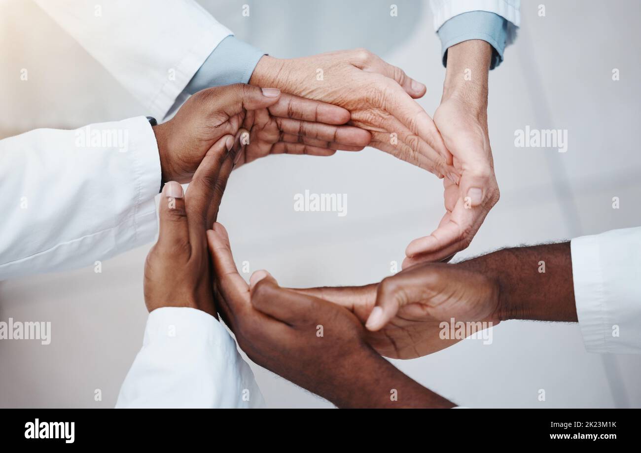 Healthcare, teamwork and doctors hands in a circle for support, trust ...