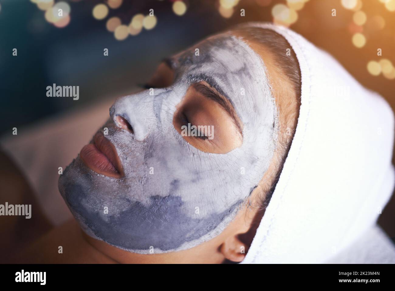 Divine skin pampering. A young woman relaxing during a facial treatment at a spa Stock Photo - Alamy