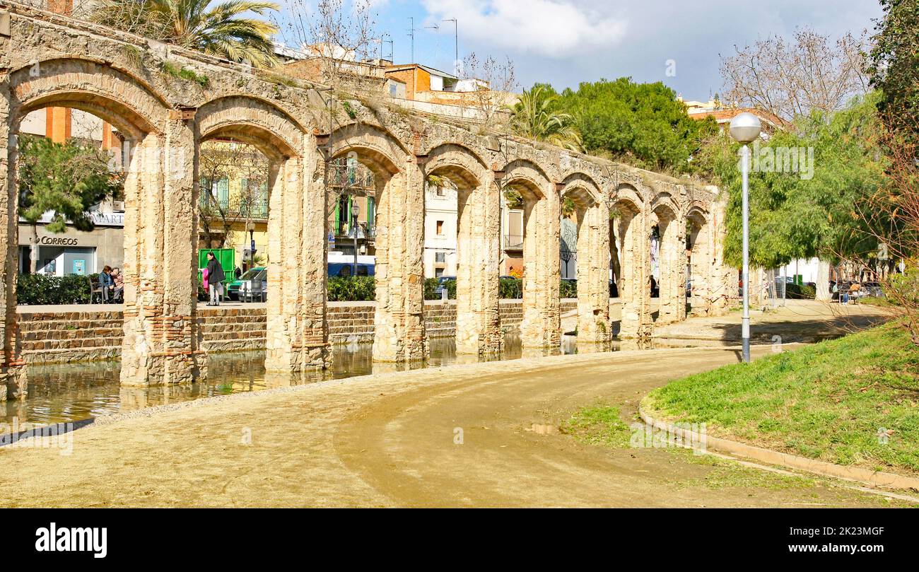 Arches and columns with fountain and pond in El Clot park, Barcelona ...