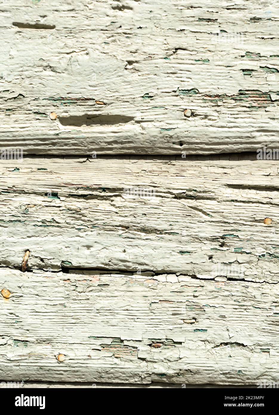 The old plank rotted with paint peeling off. Wooden background. Close ...