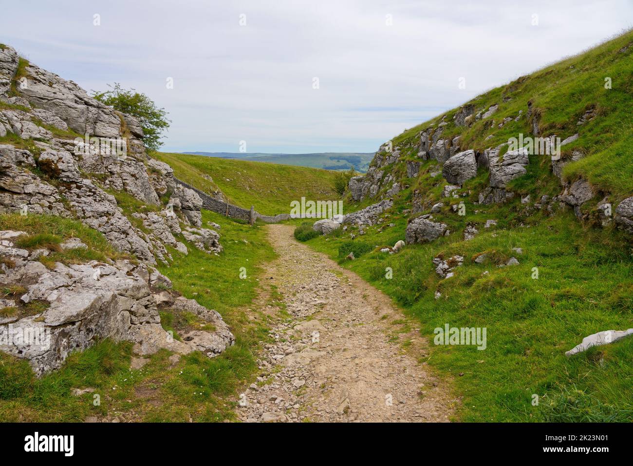 At the top of the steep climb up Cave Dale on a dull cloudy summer day ...