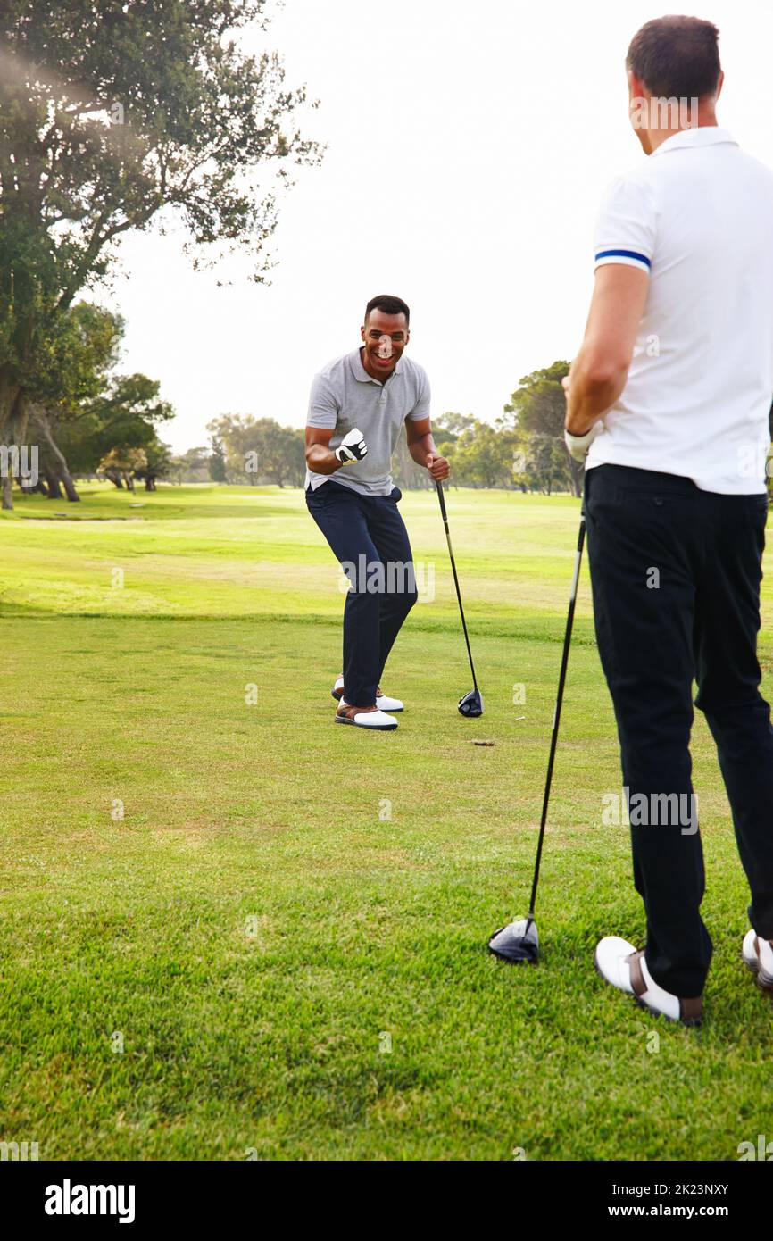 And thats how its done. Portrait of two men enjoying a game of golf ...