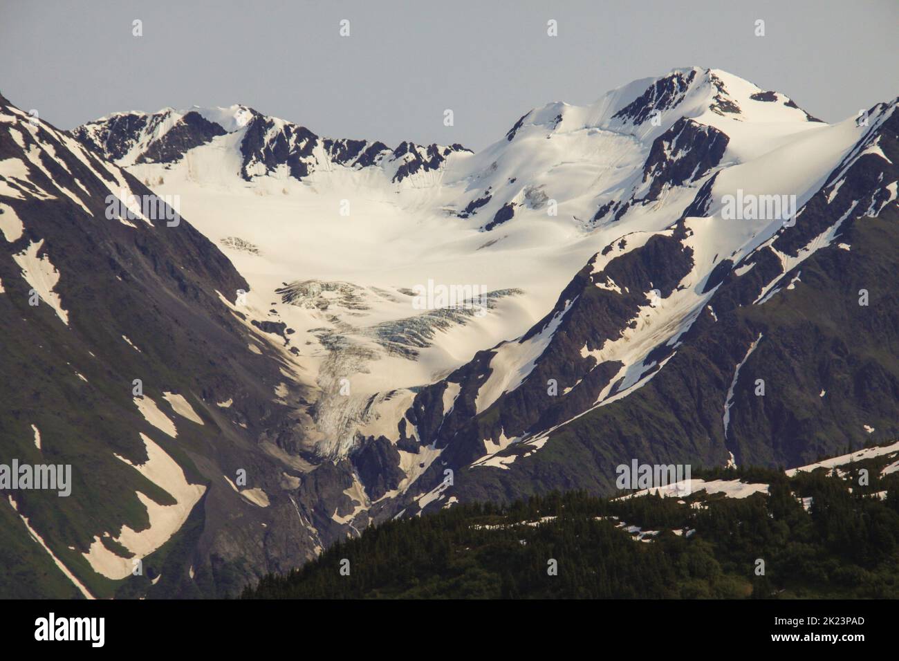 Snow covered mountain peaks Photographed near Homer, Alaska. Homer is a ...