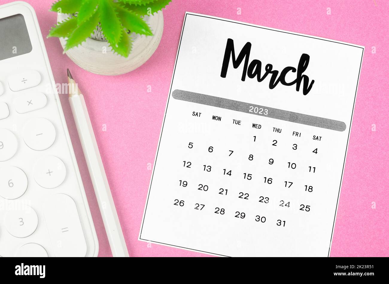 March 2023 Monthly calendar for 2023 year with calculator on pink ...