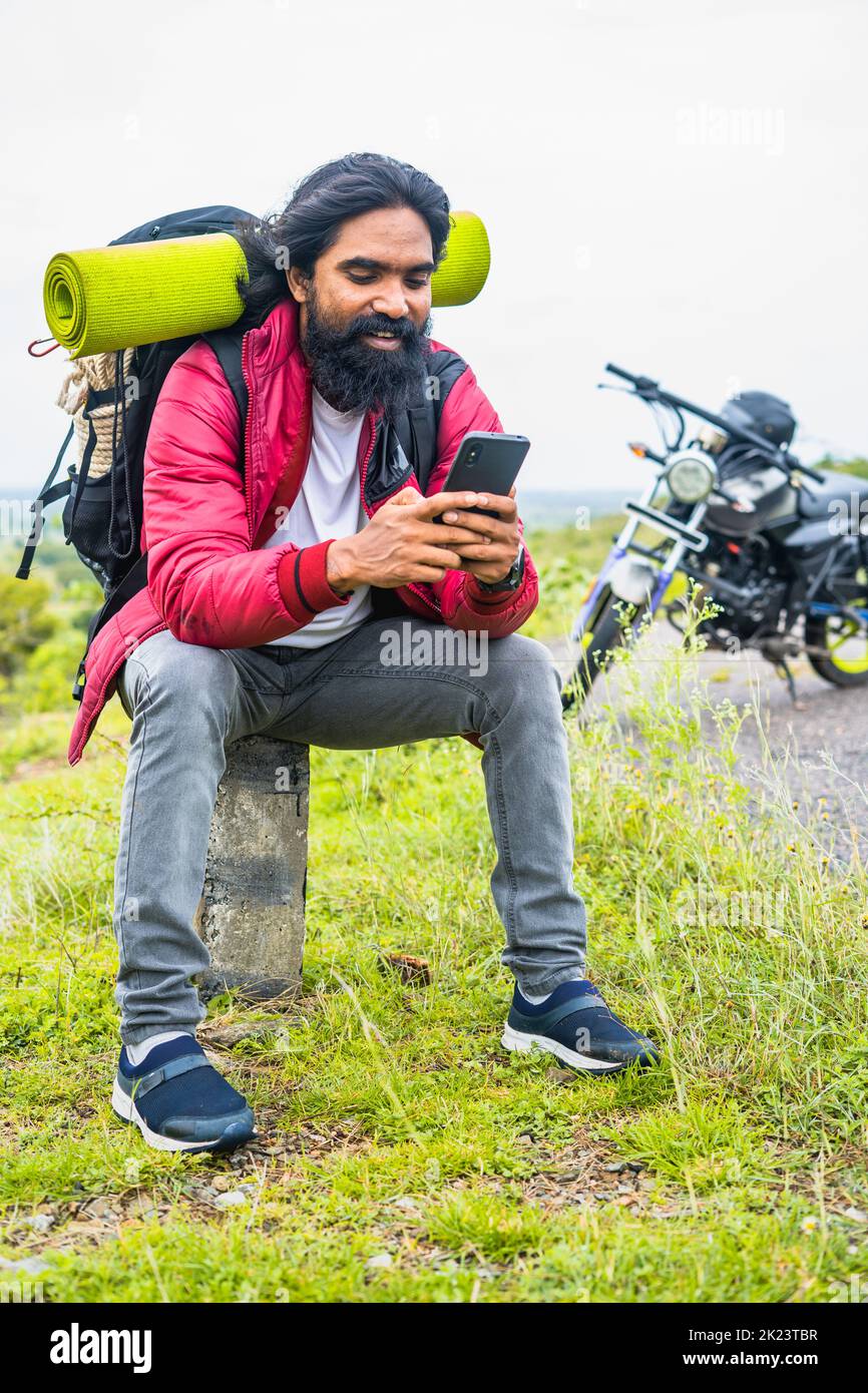 Indian man sitting on motorbike hi-res stock photography and images - Alamy