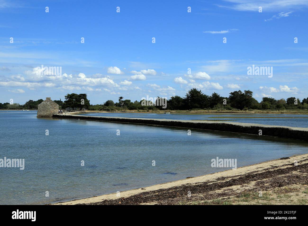 Watermill Moulin a maree de Berno and sea wall alongside the etang du ...