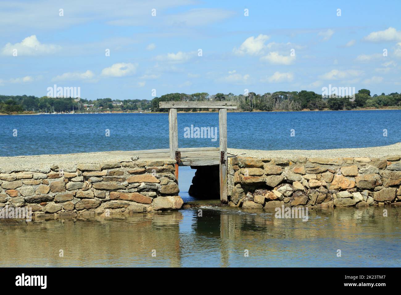 Sluice gate on sea wall close to Watermill Moulin a maree de Berno ...