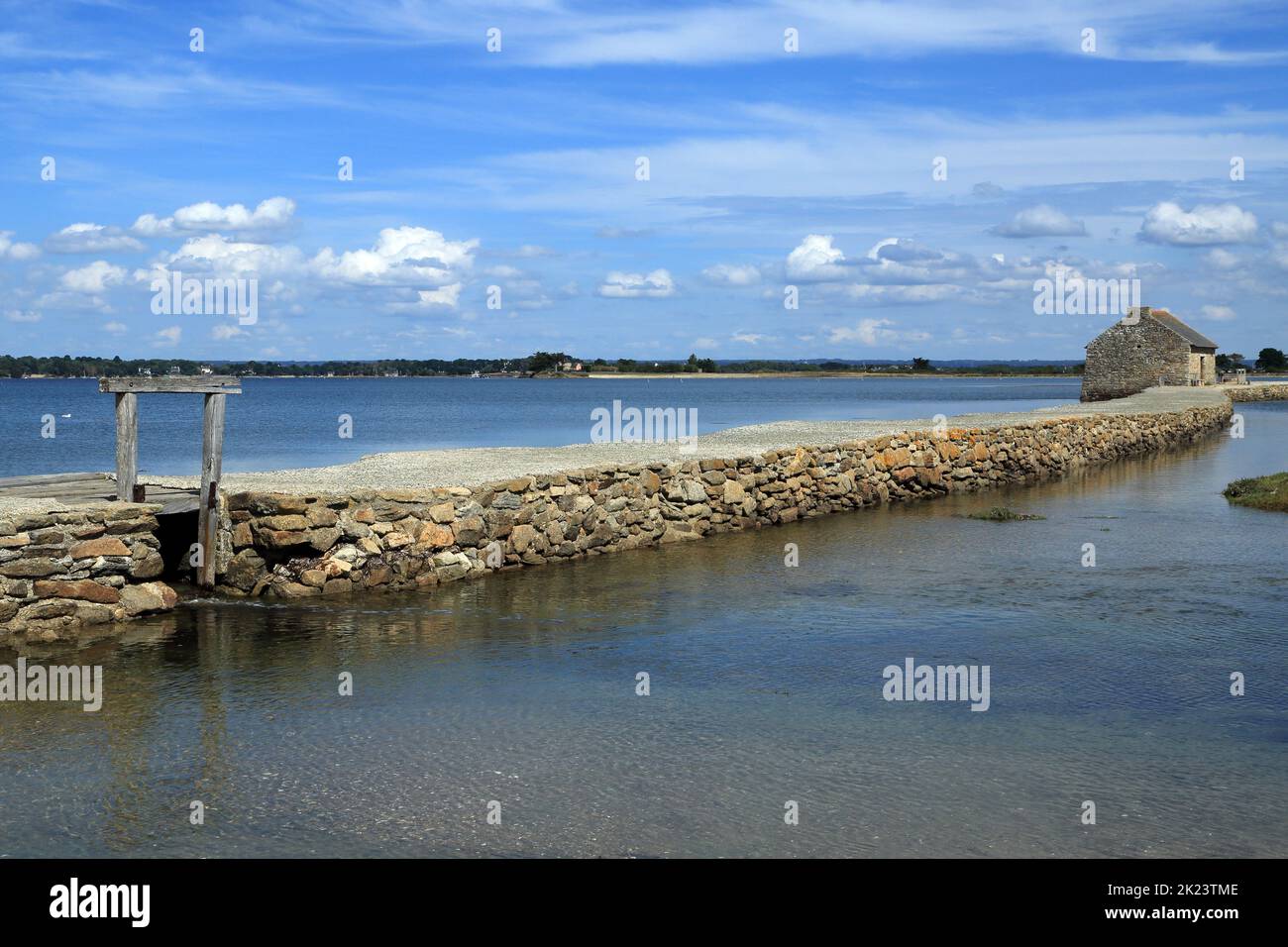 Watermill Moulin a maree de Berno and sea wall alongside the etang du ...