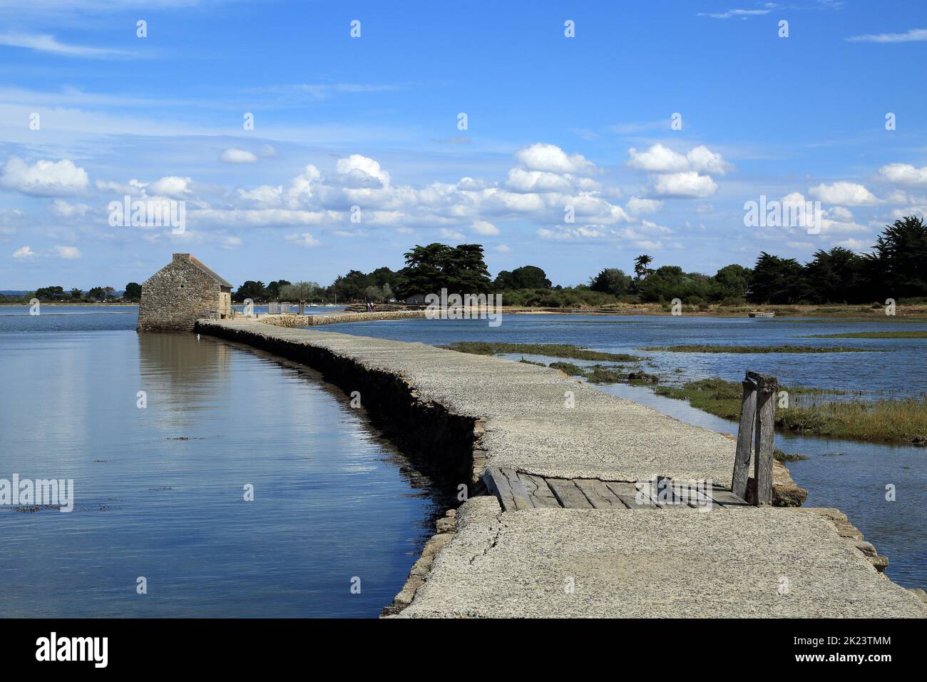 Watermill Moulin a maree de Berno and sea wall alongside the etang du ...