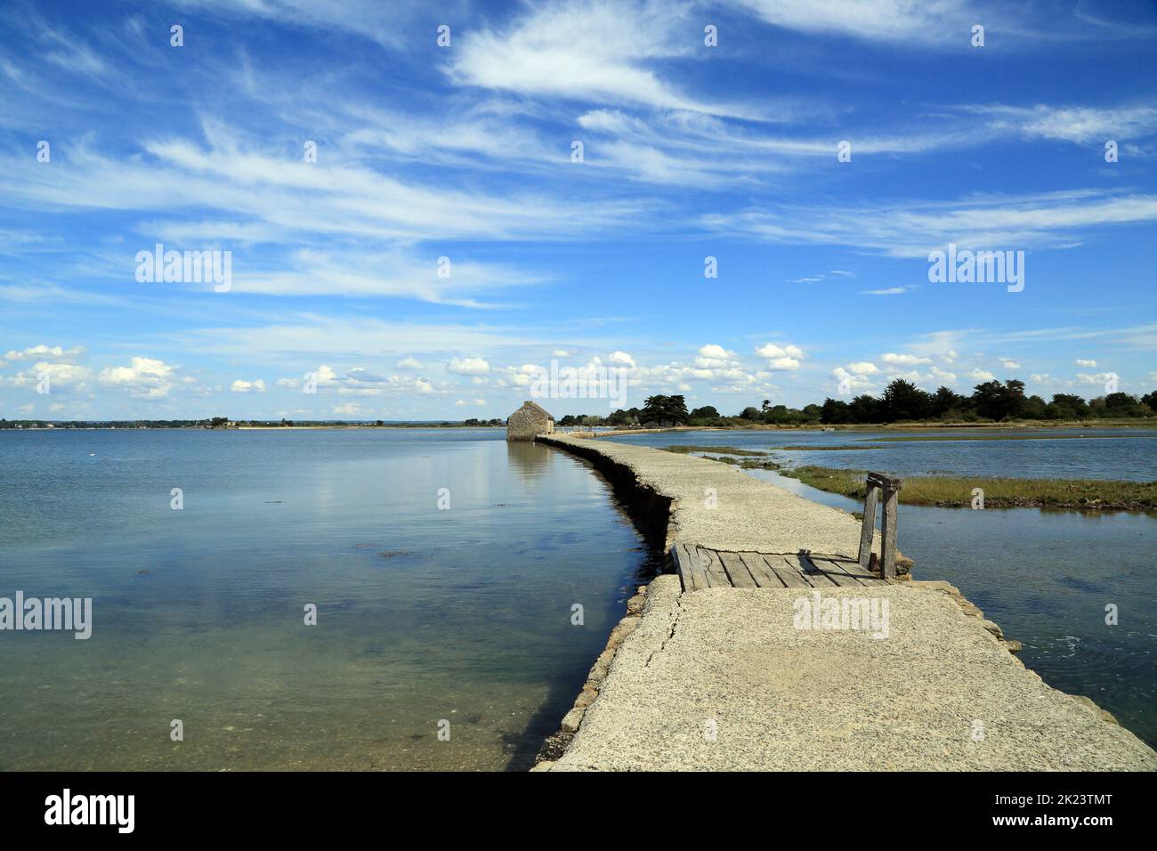 Watermill Moulin a maree de Berno and sea wall alongside the etang du ...
