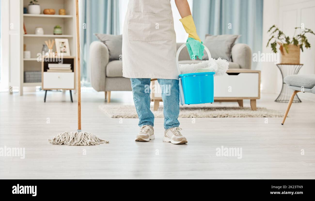 Cleaning, mop and spring cleaning equipment with woman in living room ...