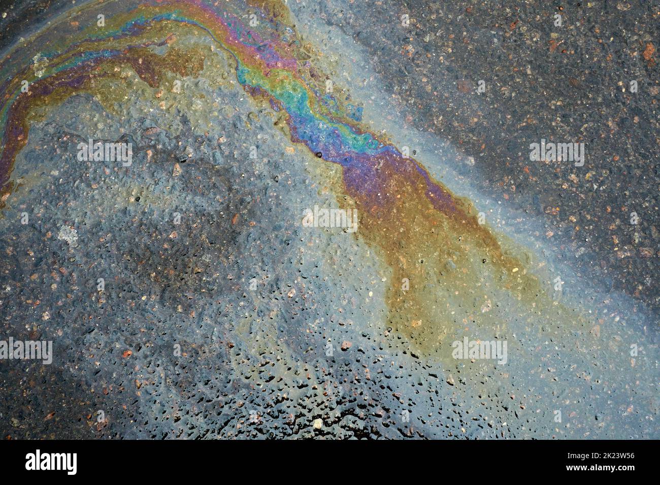 Dirty multi-colored stain from engine oil on asphalt Stock Photo - Alamy