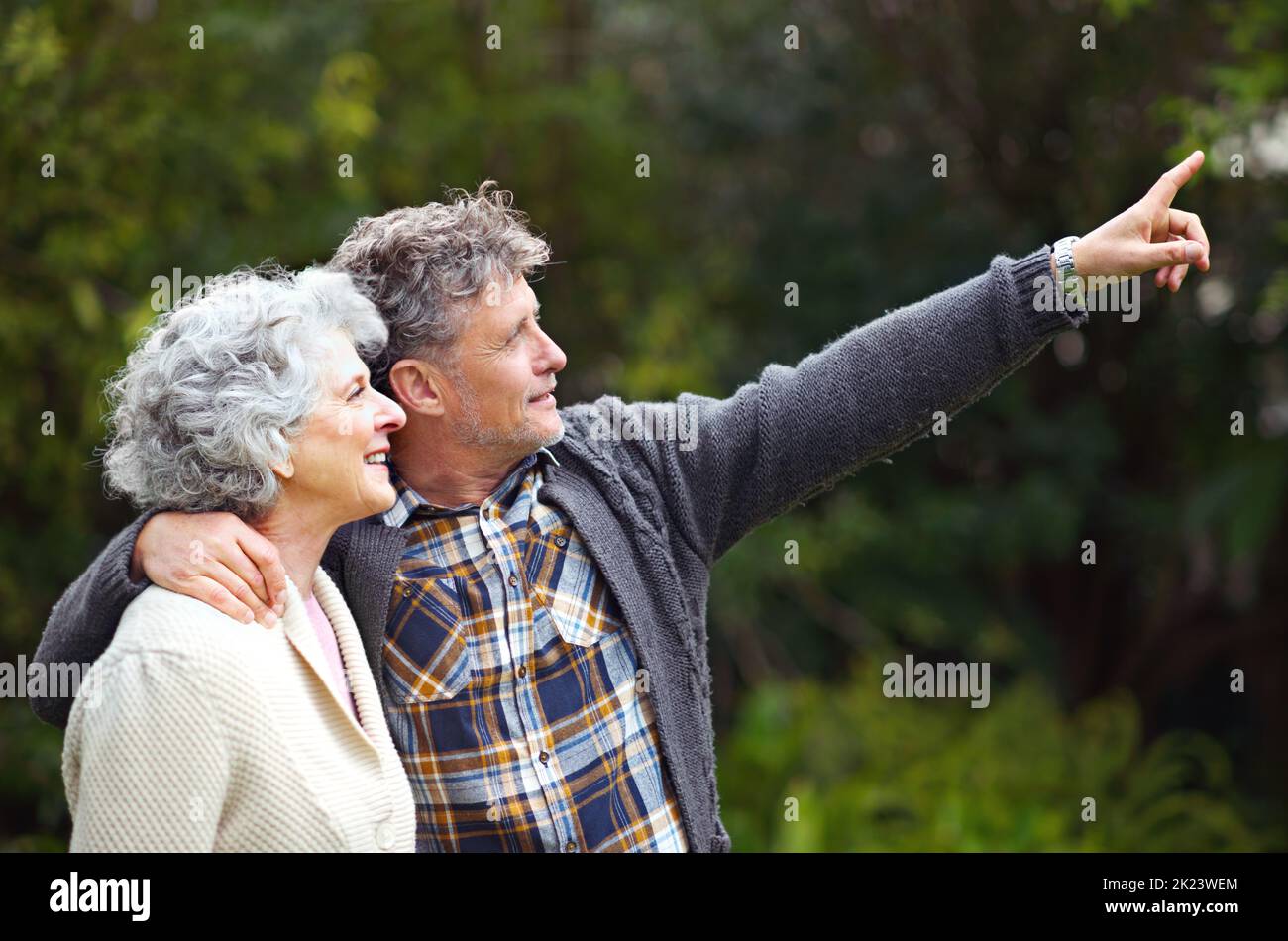 Theyve always loved the outdoors. a senior man pointing out something ...