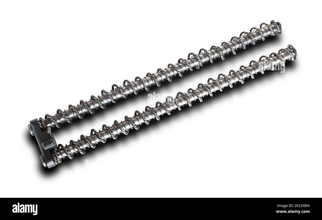 Shadow behind a pair of recoil springs that make a semi-automatic ...