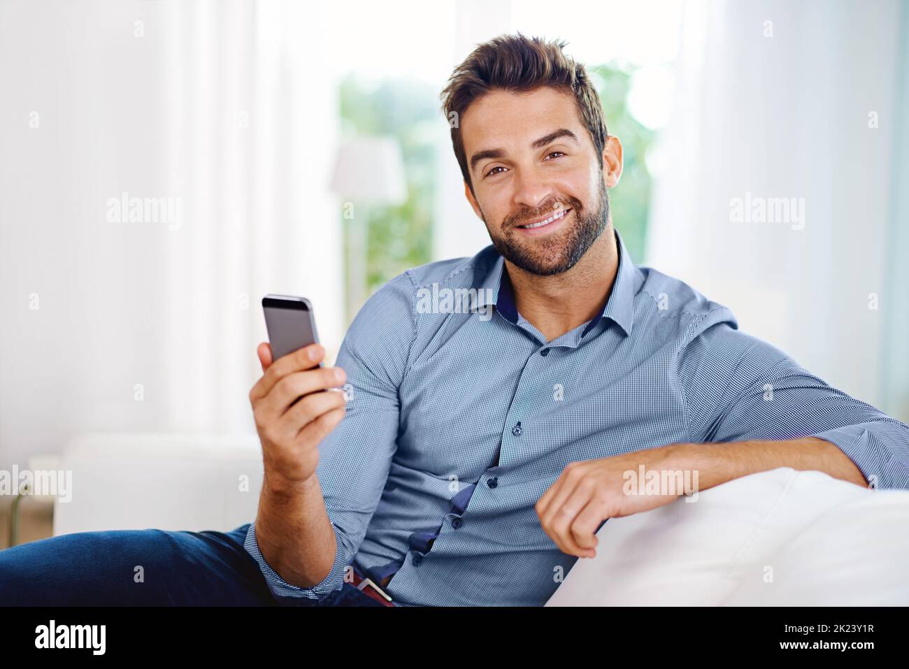 One little piece of technology, so many options. Man using his ...