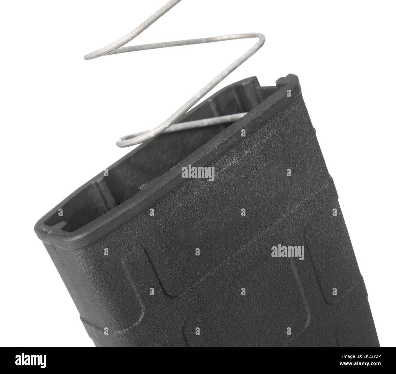 Spring being released from the bottom of an AR-15 magazine isolated on ...