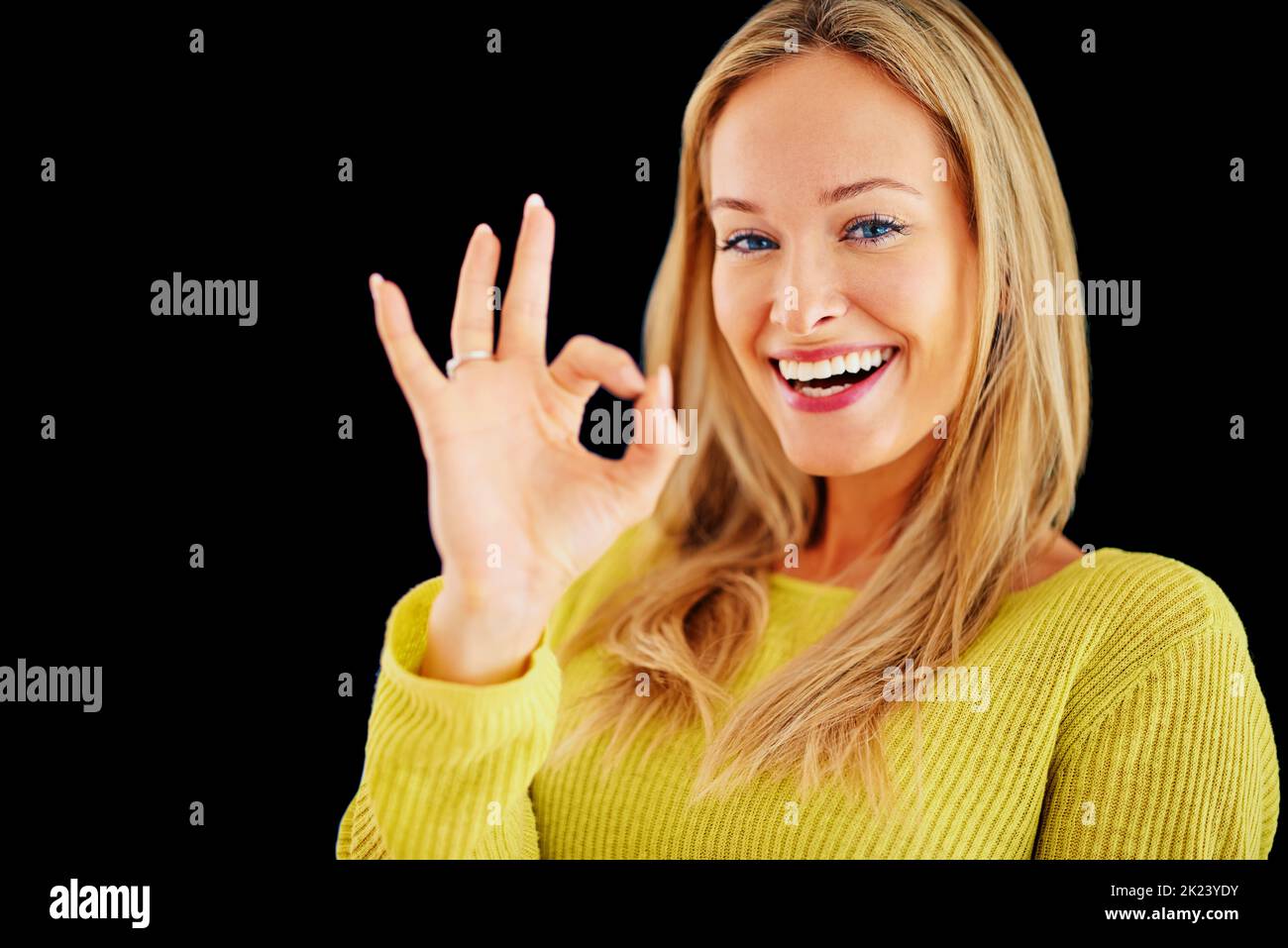 Everythings A-okay. Studio shot of a beautiful young blonde woman ...