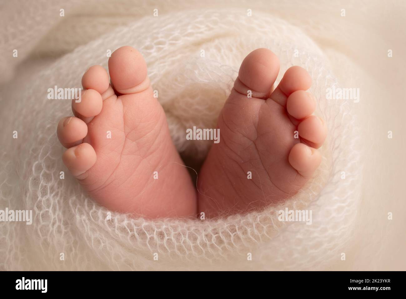 Soft feet of a newborn. Close-up of toes, heels and feet of a newborn ...