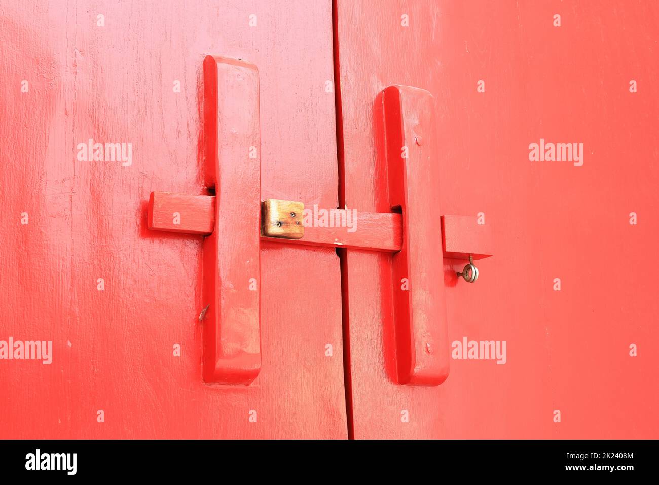 ancient timber bolt lock on a red wooden main gate Stock Photo - Alamy