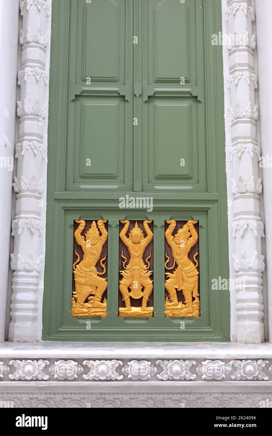 dusty white ancient building facade with beautiful green wooden windows ...
