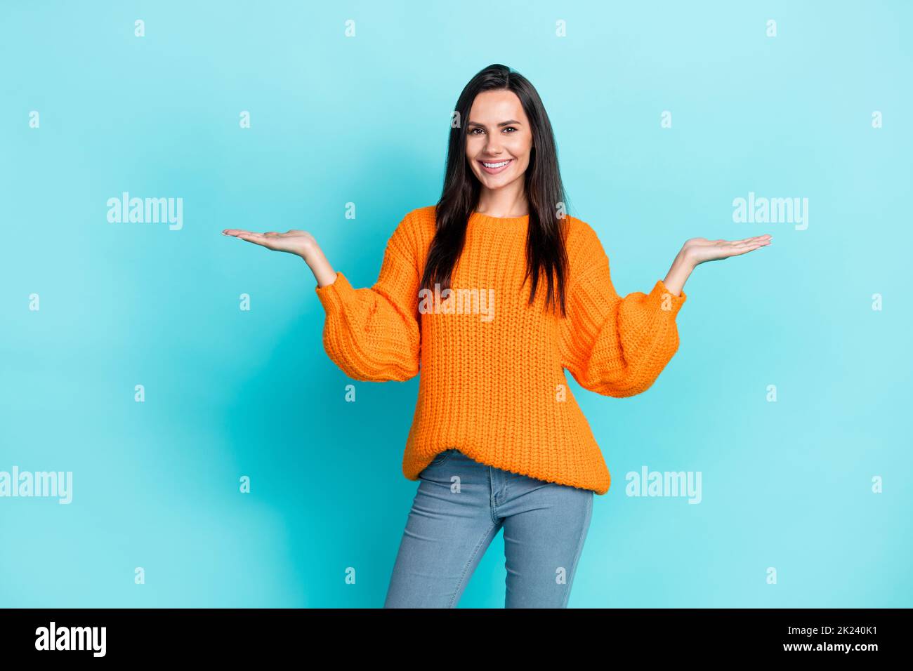 Portrait of positive nice person arms palms hold empty space ...