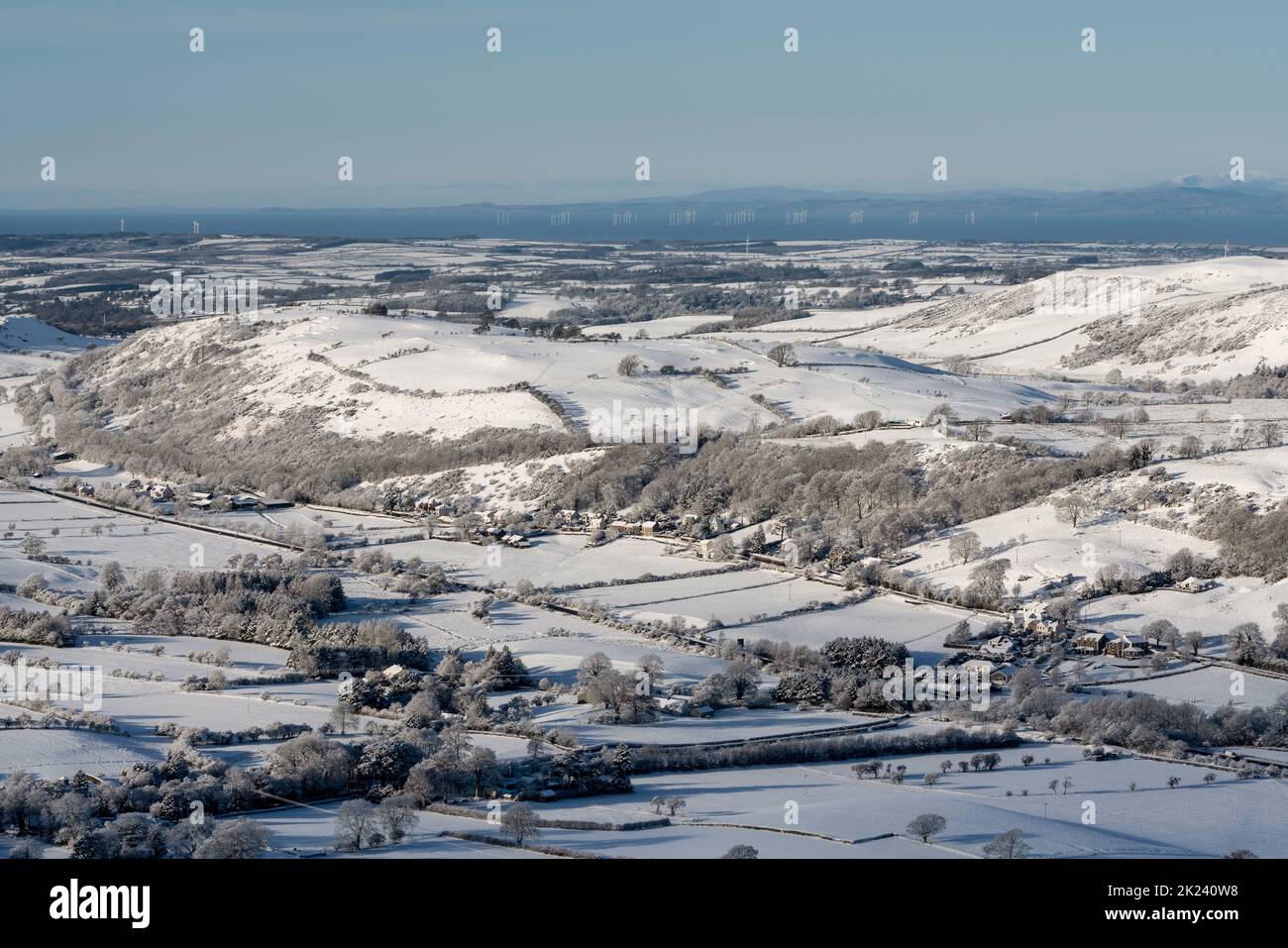 Snow covered landscape looking towards the Solway Firth and Scotland ...