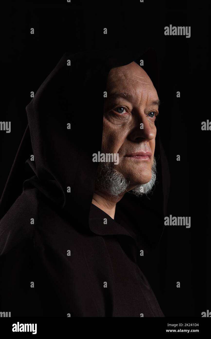 portrait of medieval monk in hooded robe isolated on black,stock image ...
