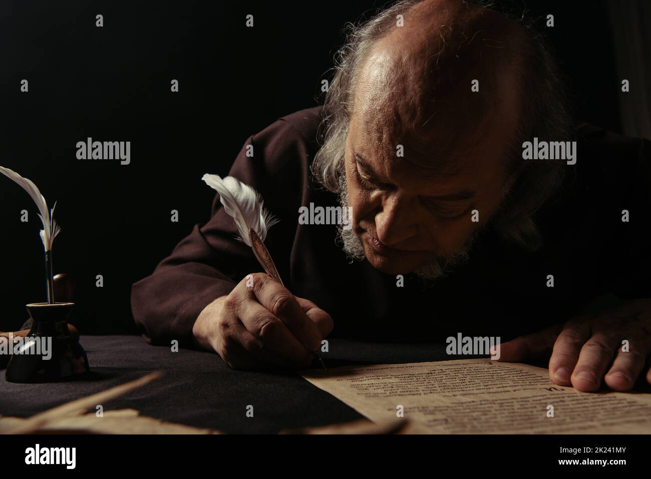 medieval chronicler writing manuscript with feather pen isolated on ...