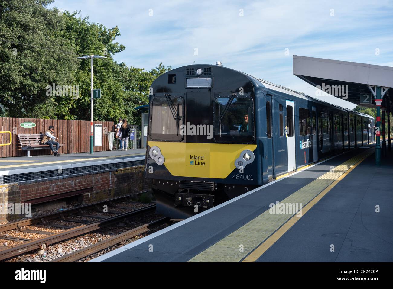Island Line train on the platform at Sandown station. The train runs ...