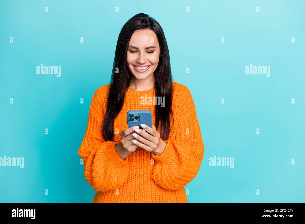 Photo of positive young person use telephone write typing post isolated ...