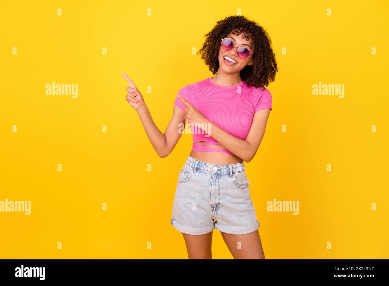 Portrait of positive charming person direct fingers empty space blank ...