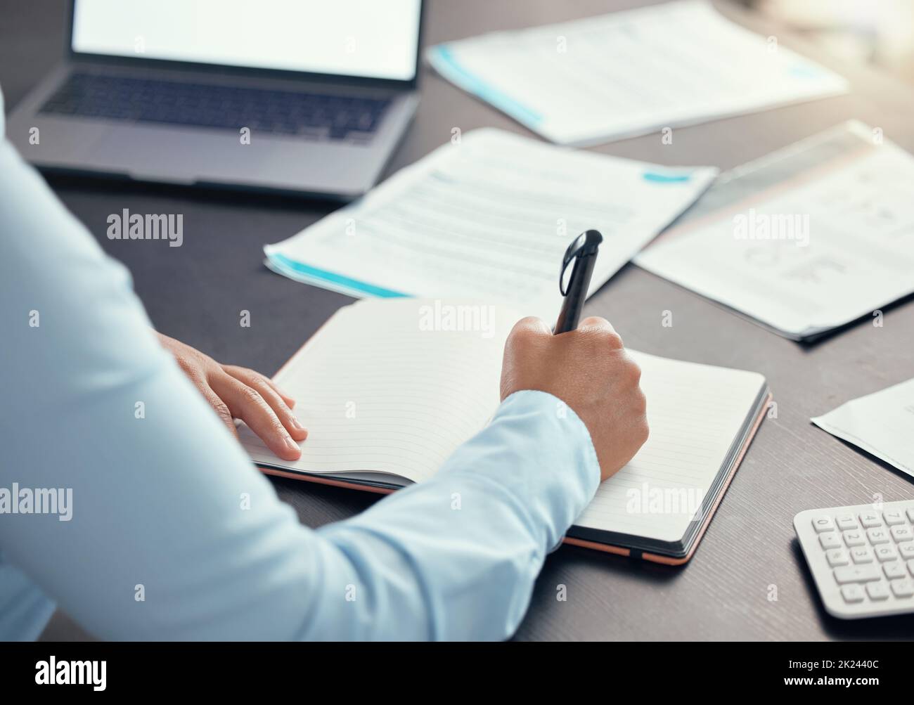 Woman writing notes, schedule and planning ideas, budget and trading ...