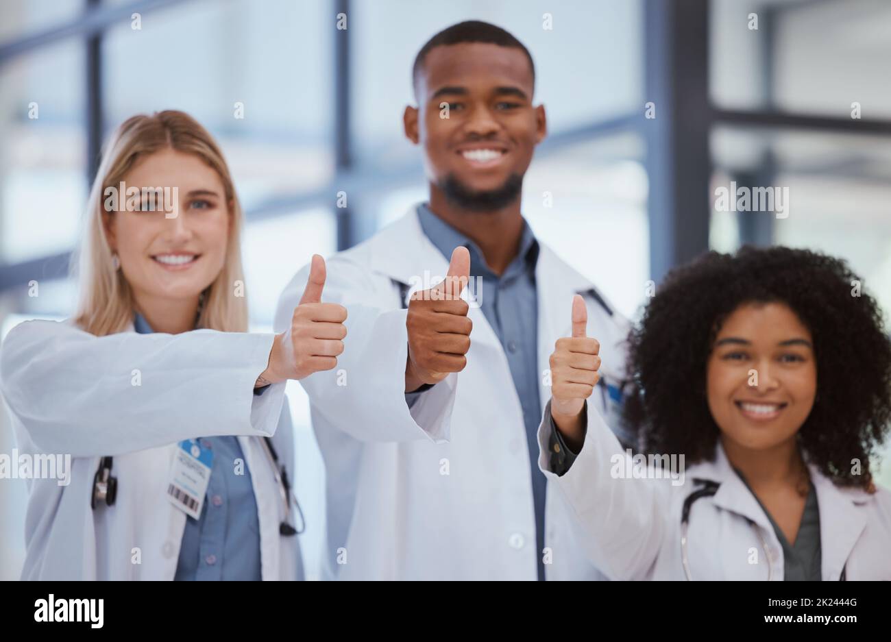 Thumbs up, hands and doctors in hospital success with thank you, winner ...