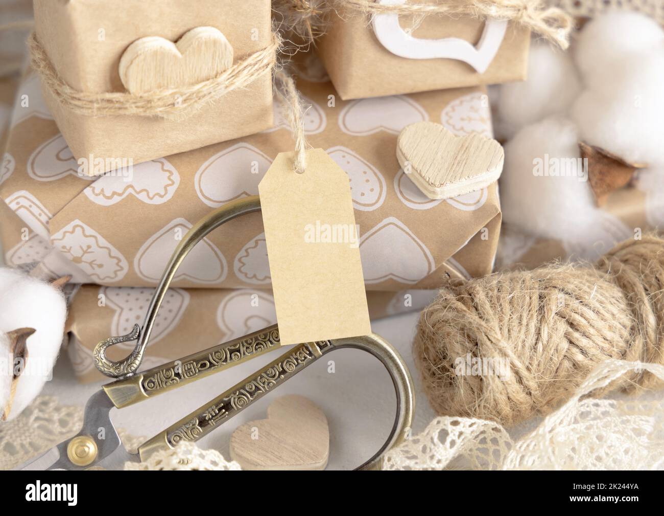 Valentines kraft paper wrapped present with vertical gift tag and ...