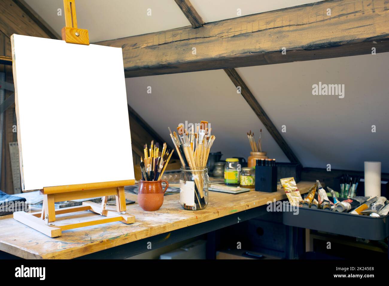 Artistic equipment in a artist studio: empty artist canvas on wooden ...
